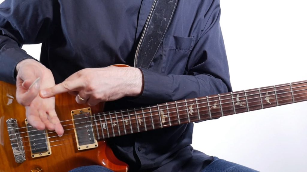 Palm Muting - Learn this essential rock guitar technique! - 2 Minute Guitar